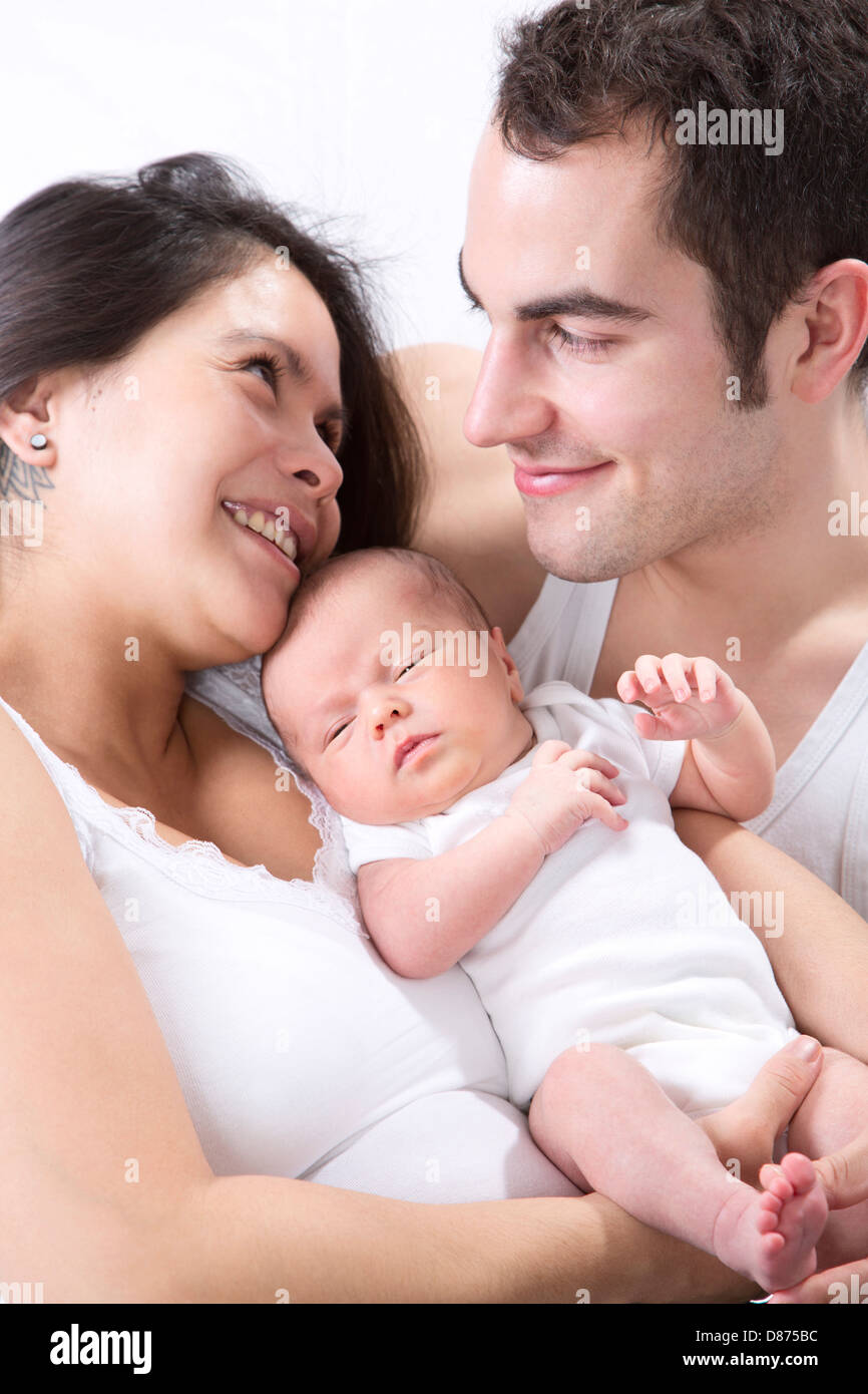 Parents with baby boy, smiling Stock Photo - Alamy
