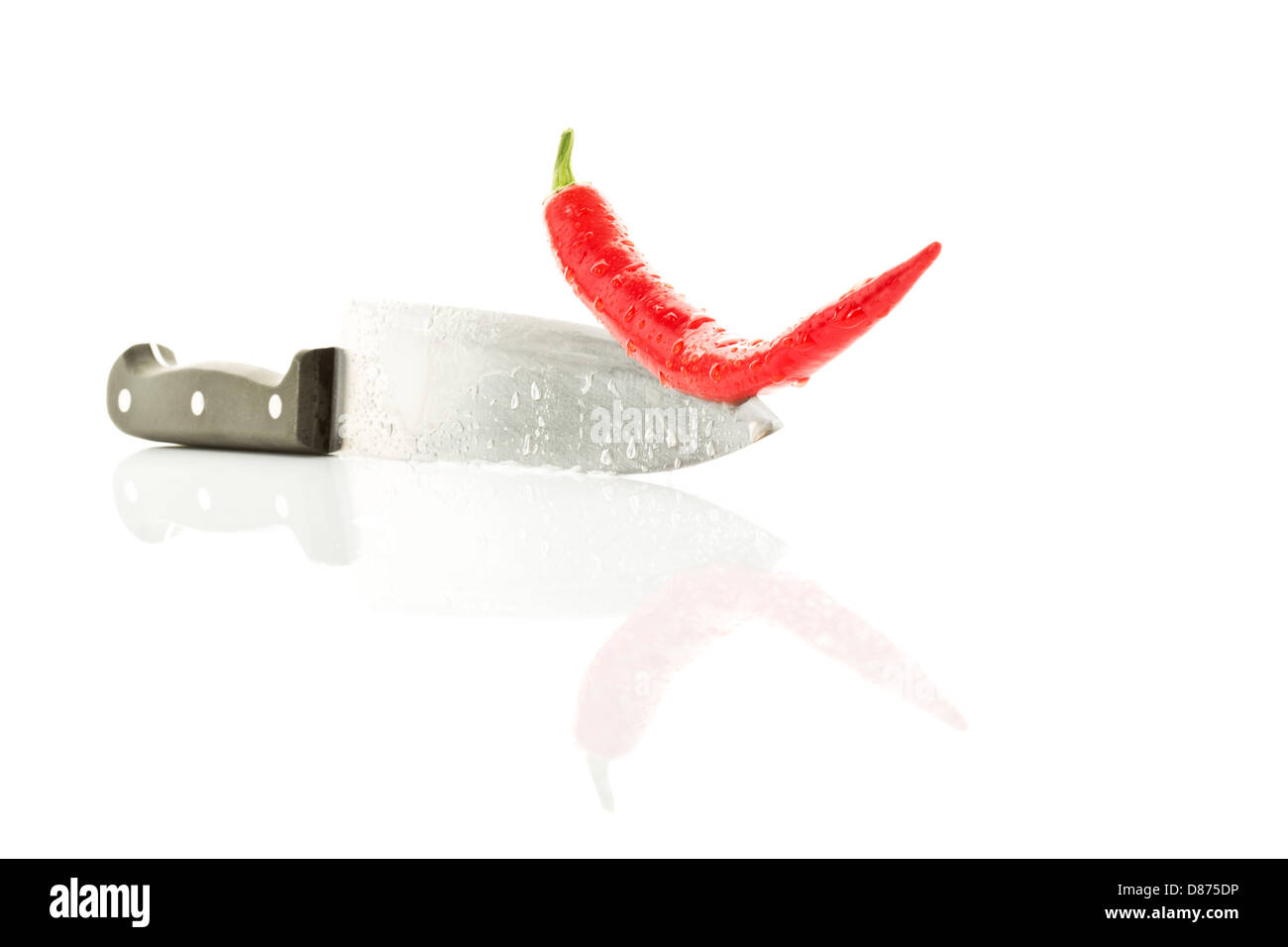 Red chilli pepper with kinfe on white background, close up Stock Photo ...