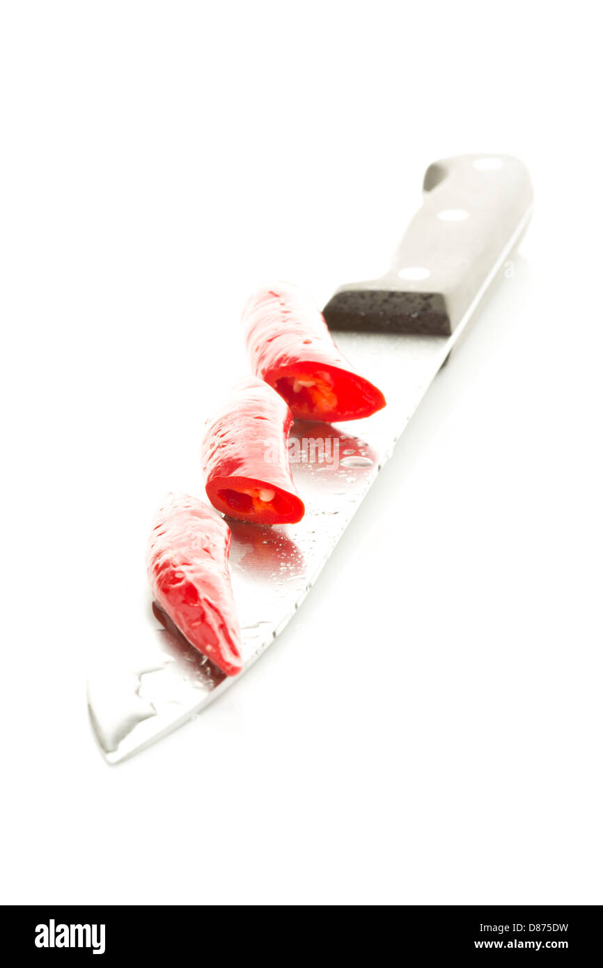 Red chilli pepper with kinfe on white background, close up Stock Photo ...