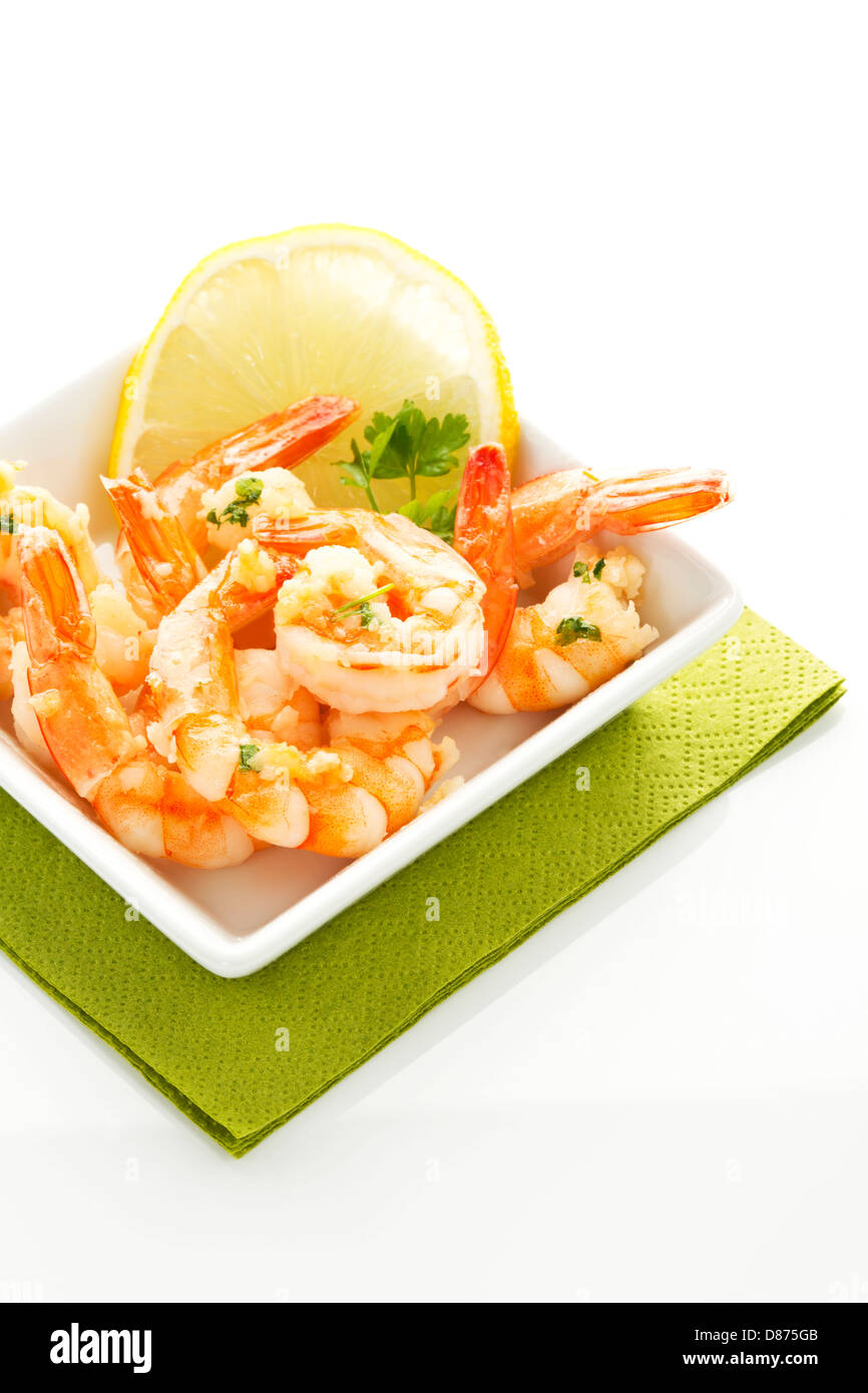 Plate of prawns on white background, close up Stock Photo - Alamy