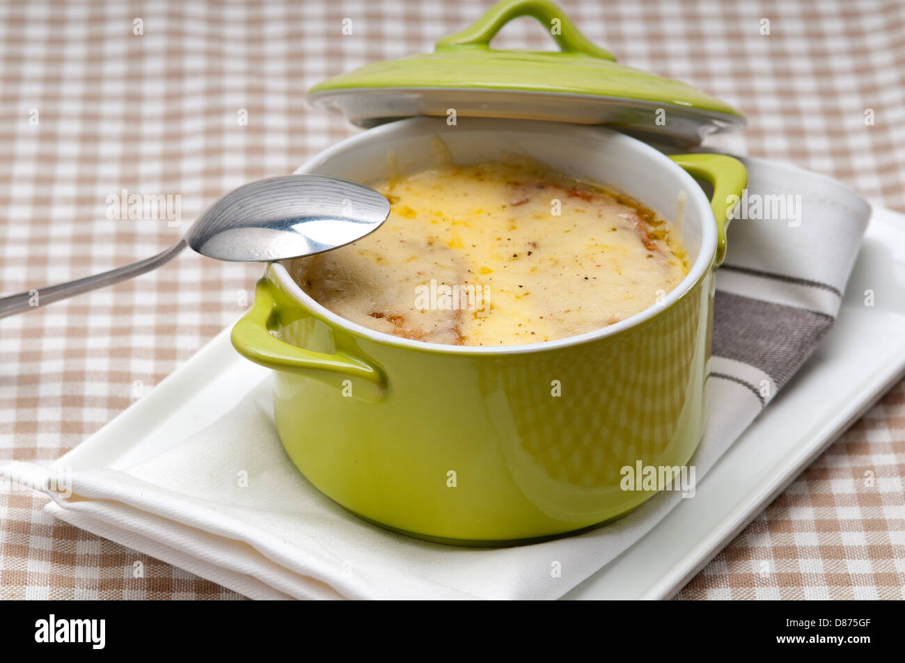 onion soup on clay pot with melted cheese and bread on top Stock Photo ...