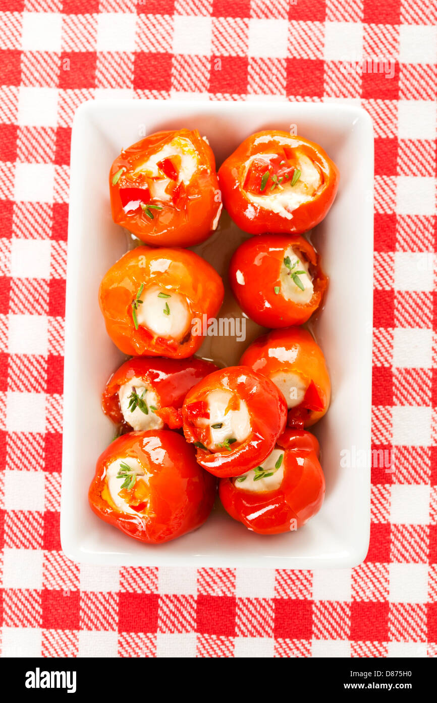 Bell pepper filled with cheese on plate Stock Photo - Alamy