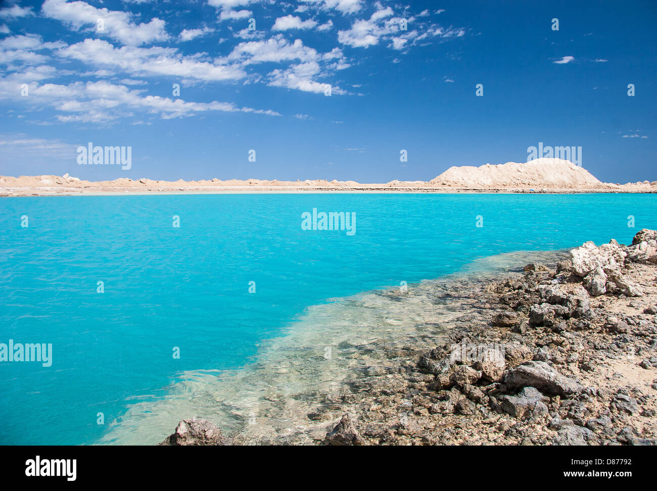Amazing Blue lake among the sand and rocks Stock Photo - Alamy