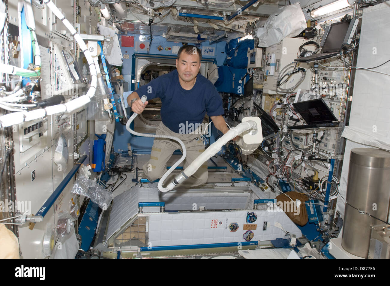 The image shows the International Space Station (ISS) orbiting Earth ...