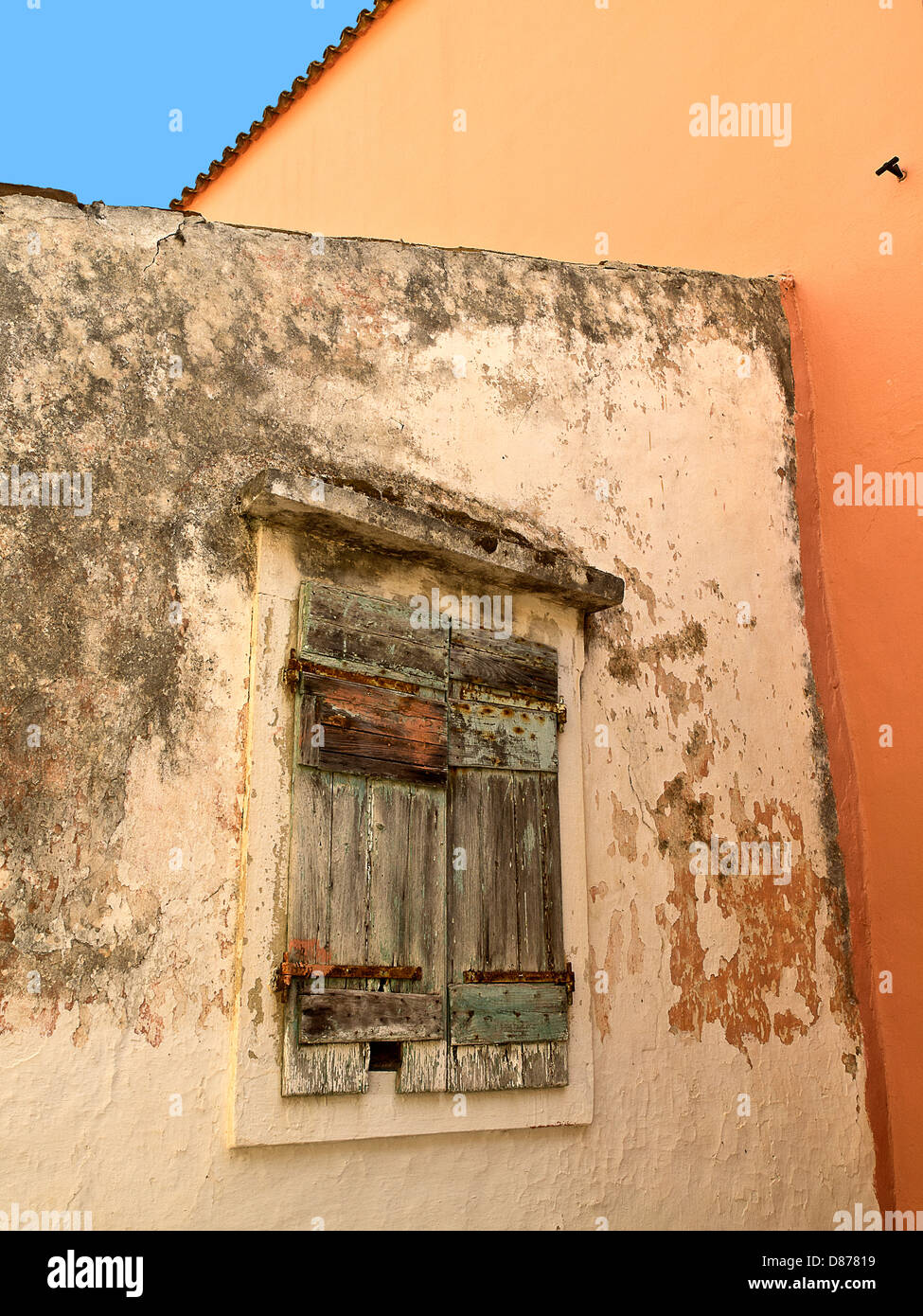The old Greek house with a window and closed shatters, Lakones Village ...