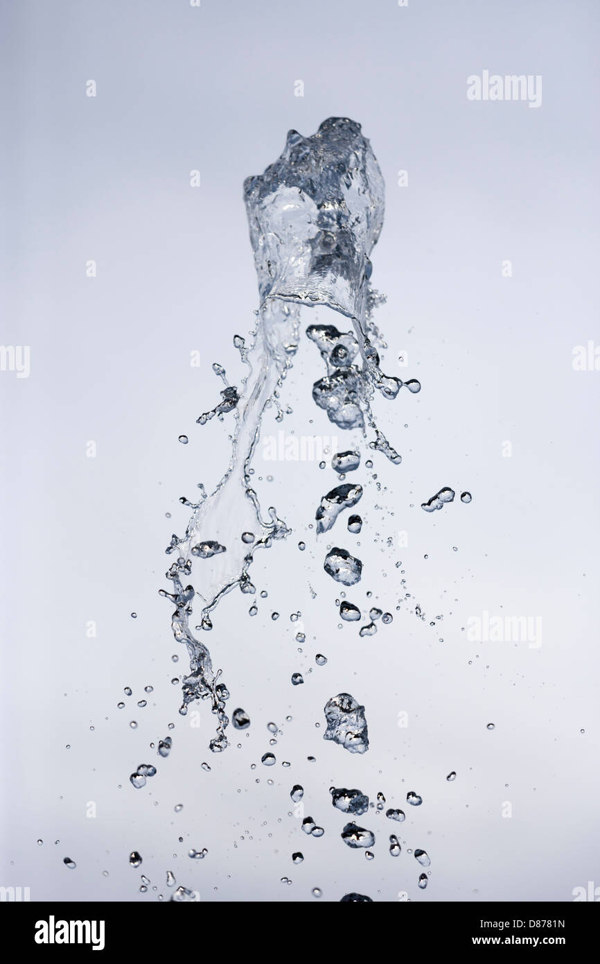 Splashing water against white background Stock Photo - Alamy