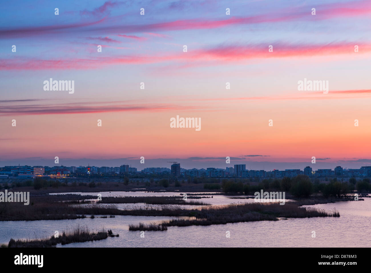 Purple sunset over south-eastern Bucharest suburbs near Vacaresti Lake ...
