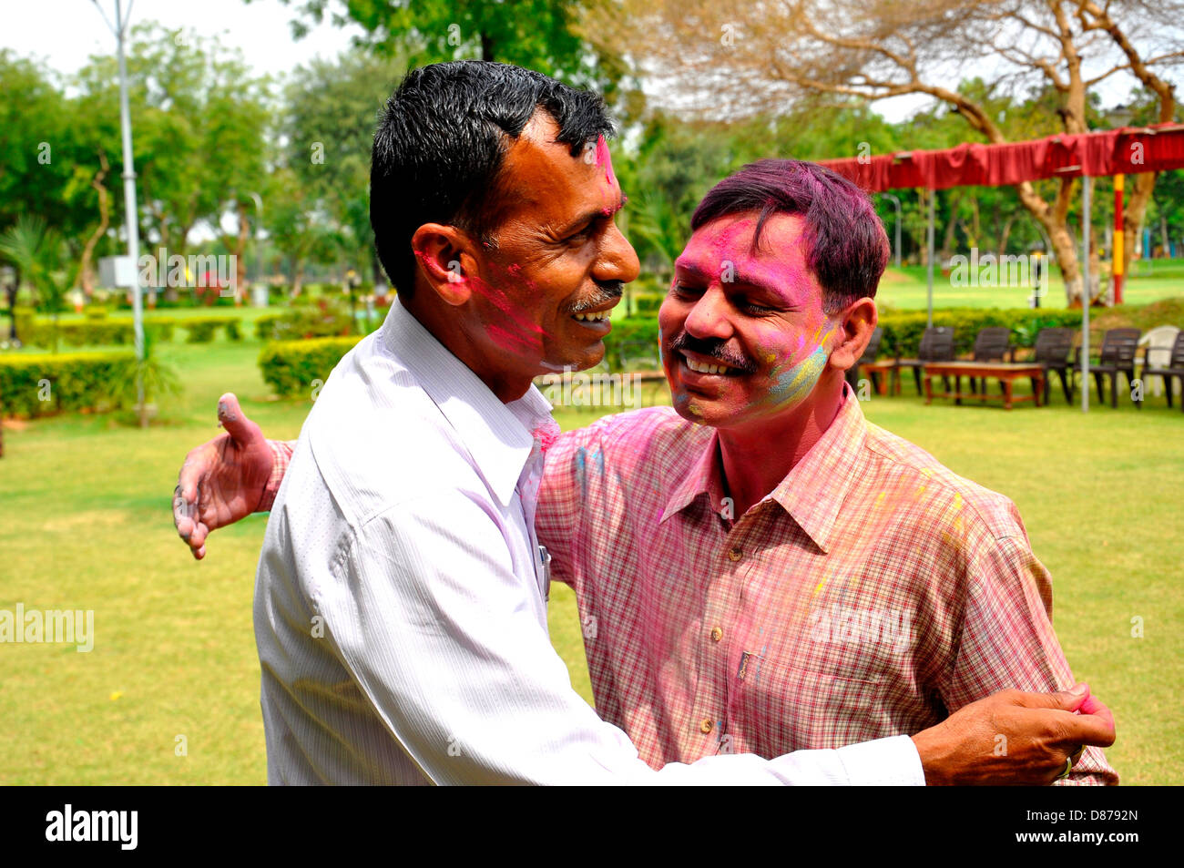 Two Indians hugging each other on the eve of Holi festival Stock Photo ...