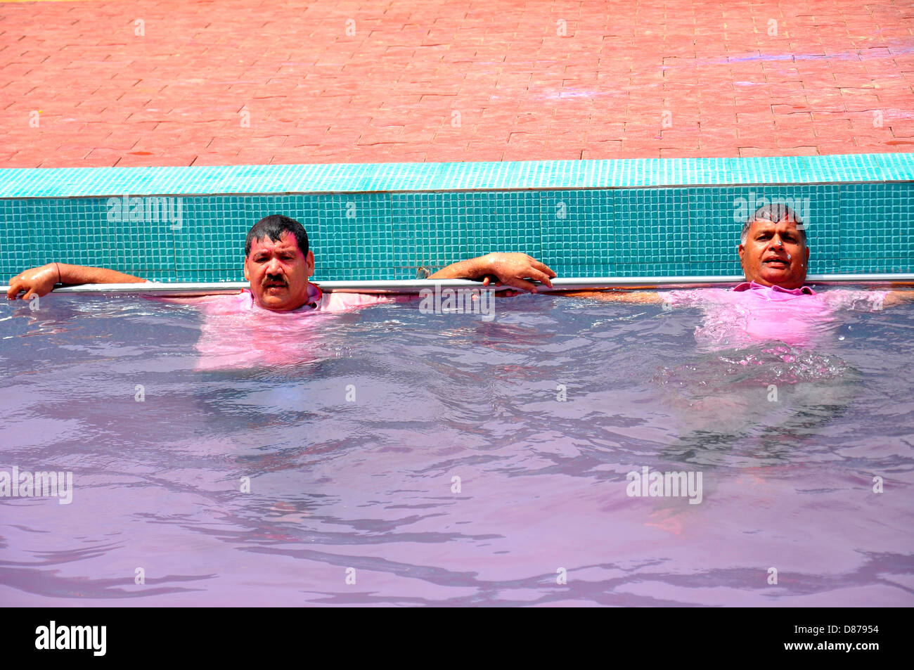 Two Indians enjoying in water of a swimming pool Stock Photo - Alamy