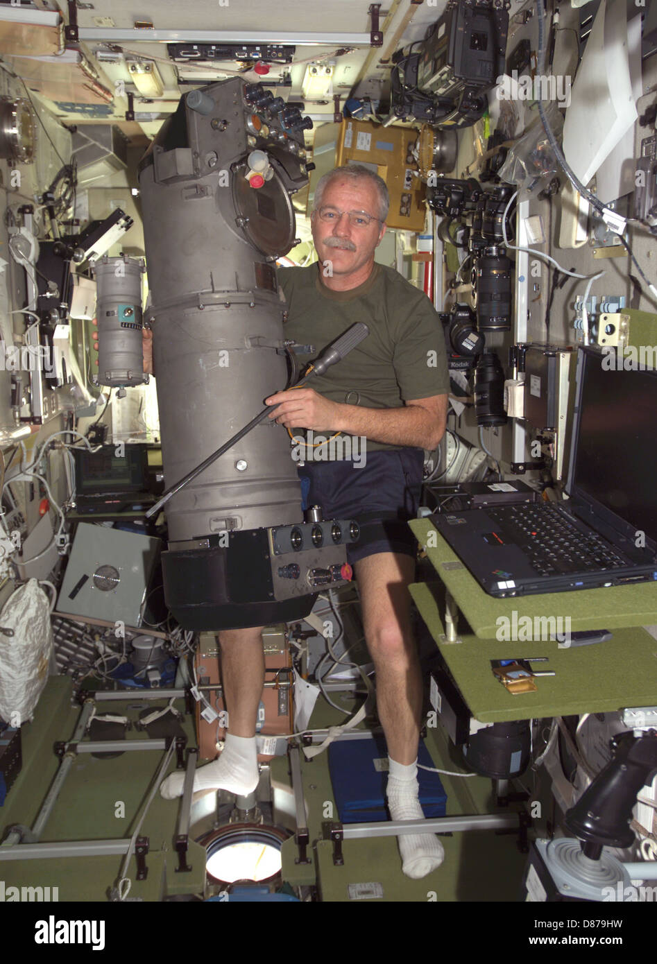 Astronaut John Phillips works on the Elektron system aboard the ...