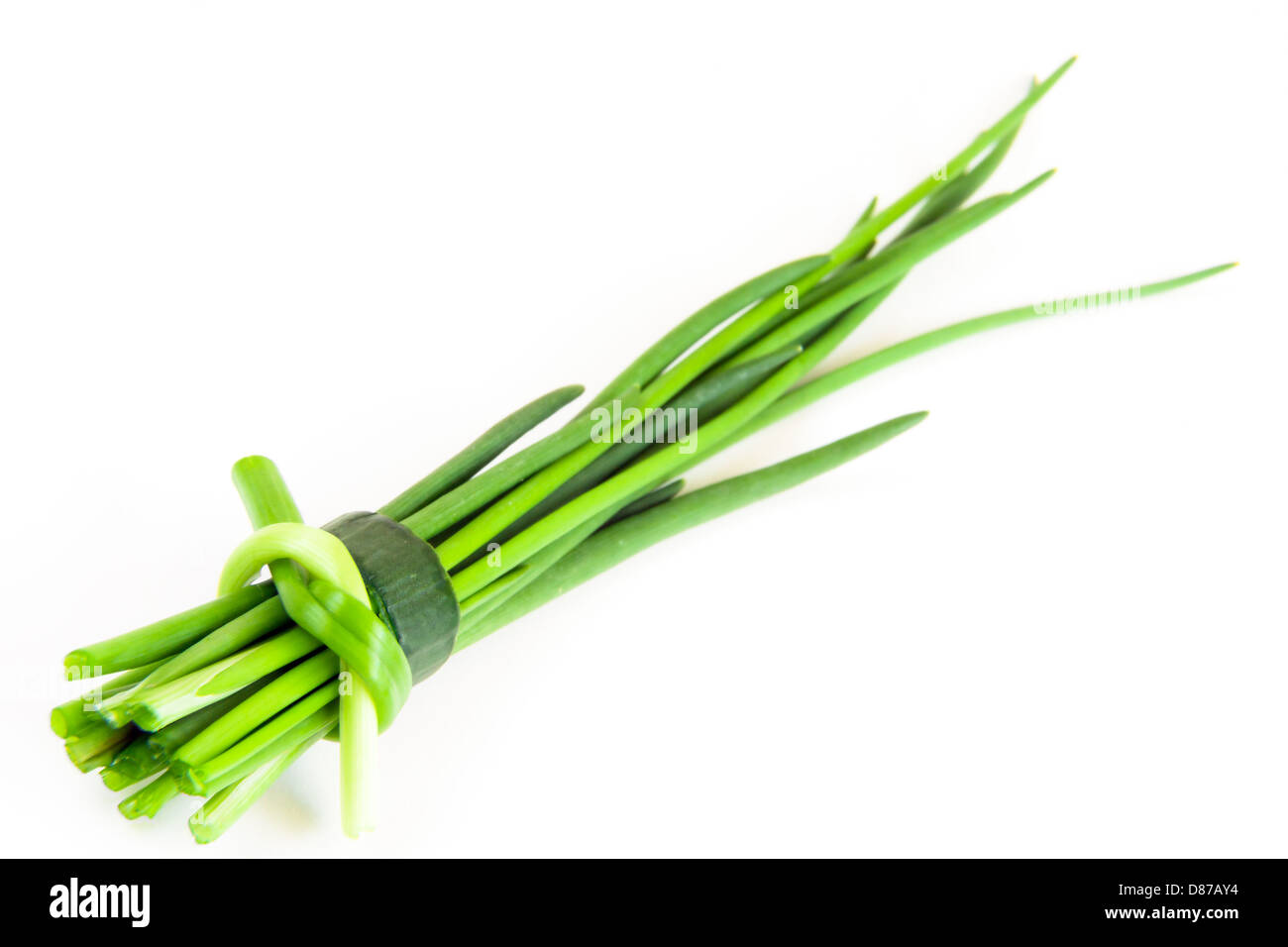 green fresh chive on white background Stock Photo - Alamy