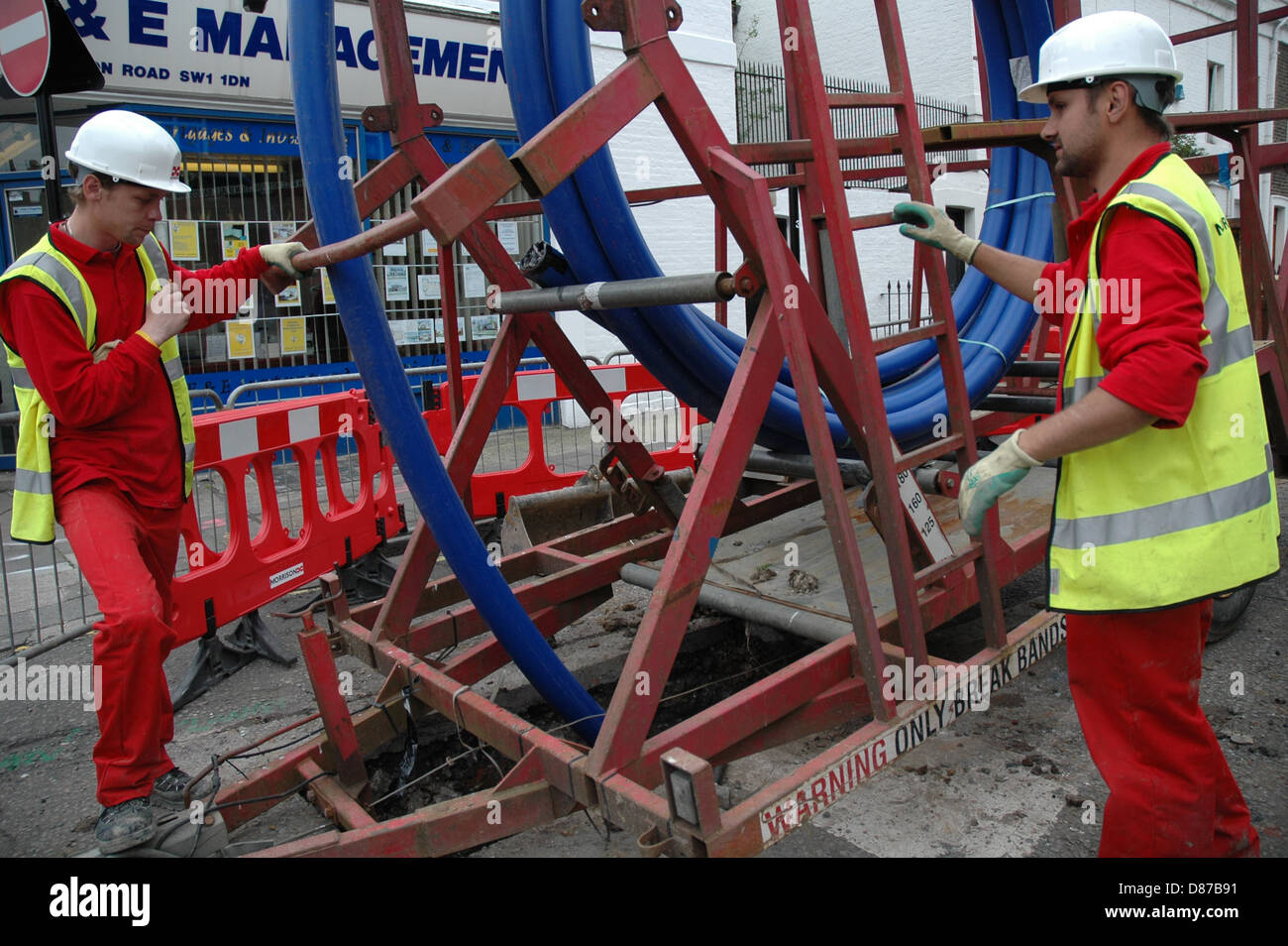 Laying underground electric cables Stock Photo - Alamy