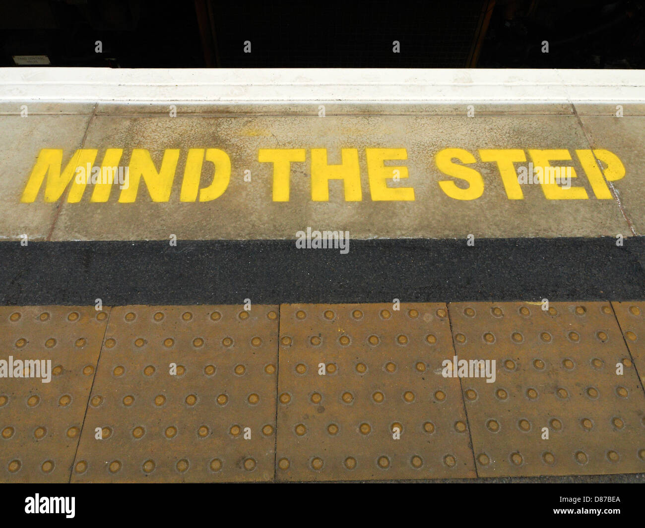 Mind the step, health and safety warning Stock Photo - Alamy