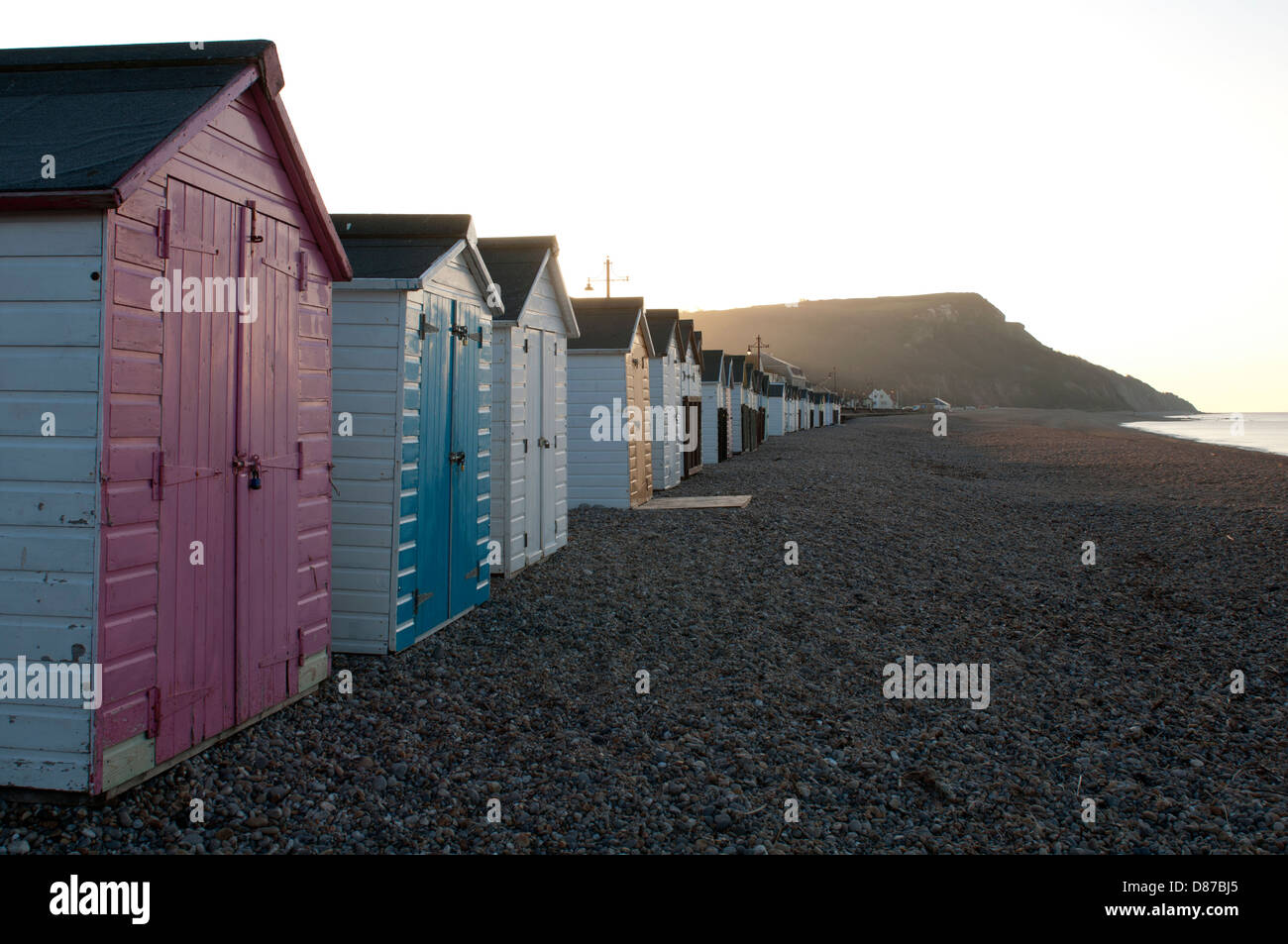 Seaton beach and beach huts at dawn, Devon, England, UK Stock Photo - Alamy