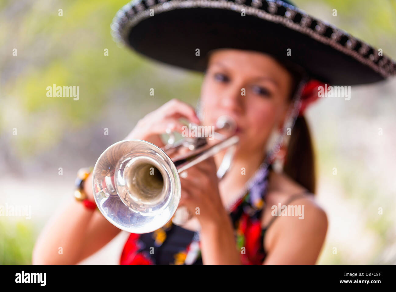 Woman blowing trumpet hi-res stock photography and images - Alamy