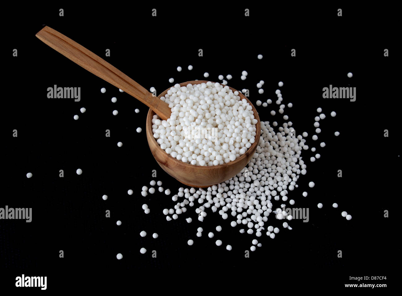 Tapioca pearls in small wood bowl on black background Stock Photo - Alamy