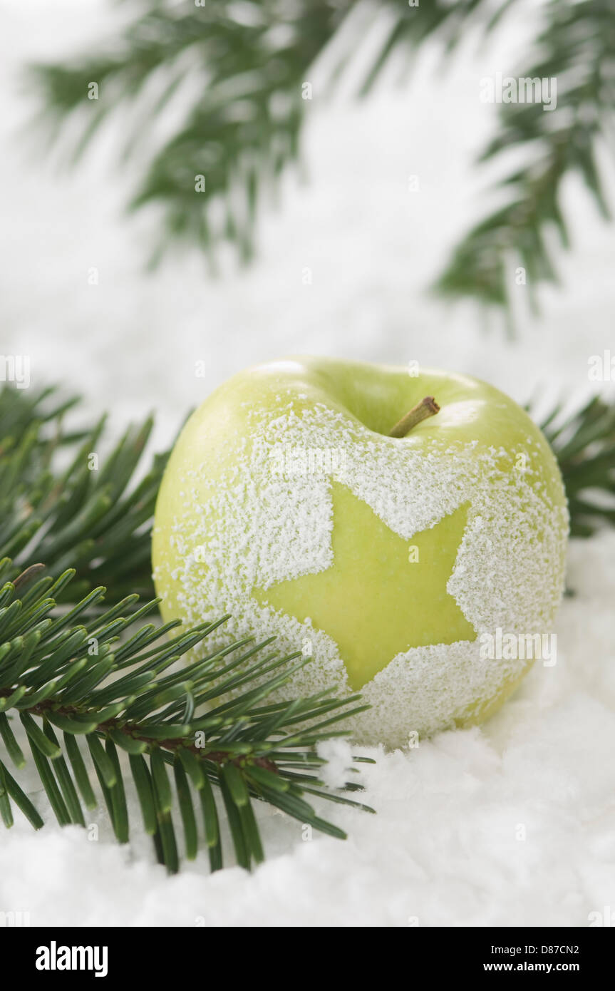 Apple with snow star, close up Stock Photo - Alamy
