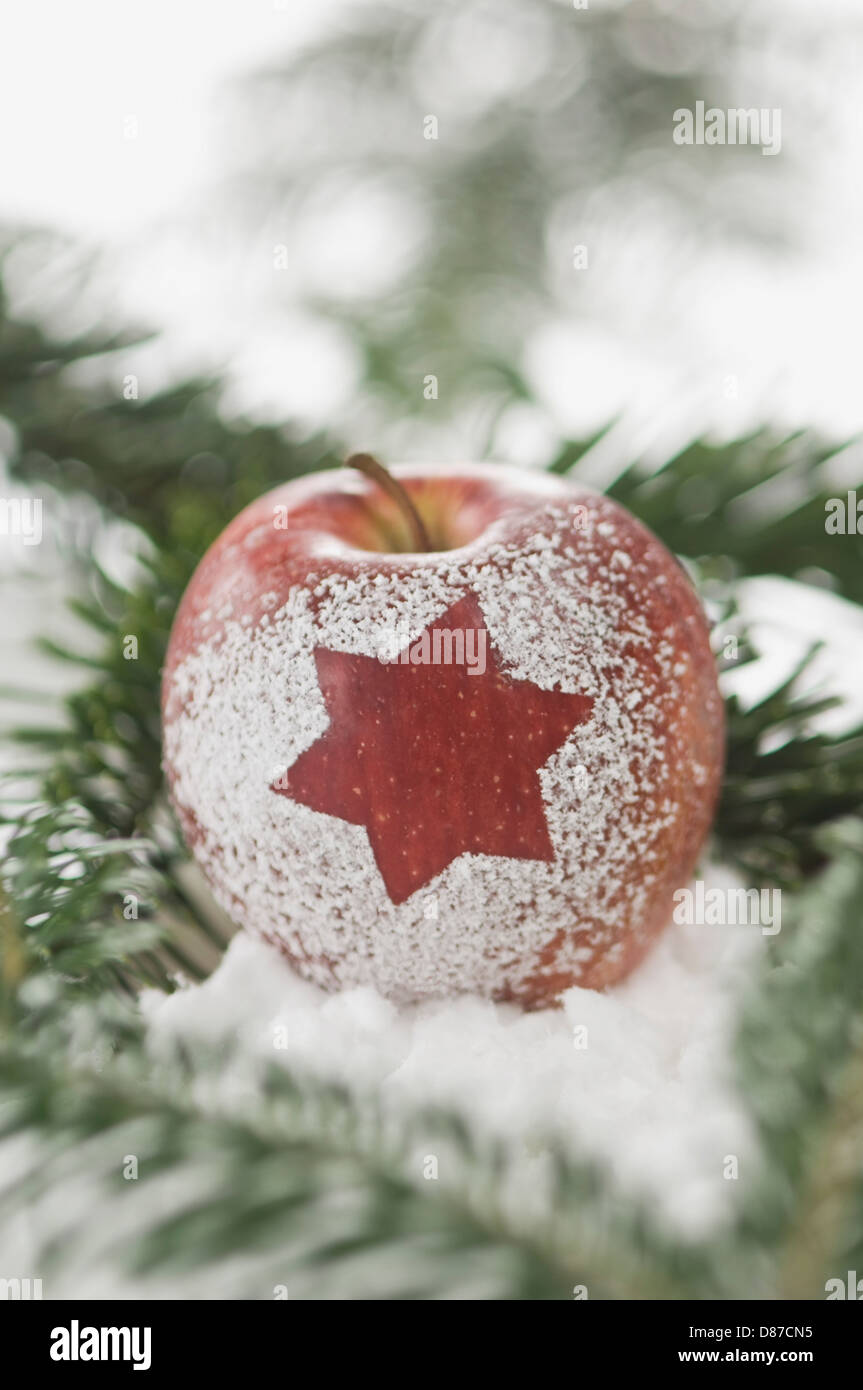 Apple with snow star, close up Stock Photo - Alamy