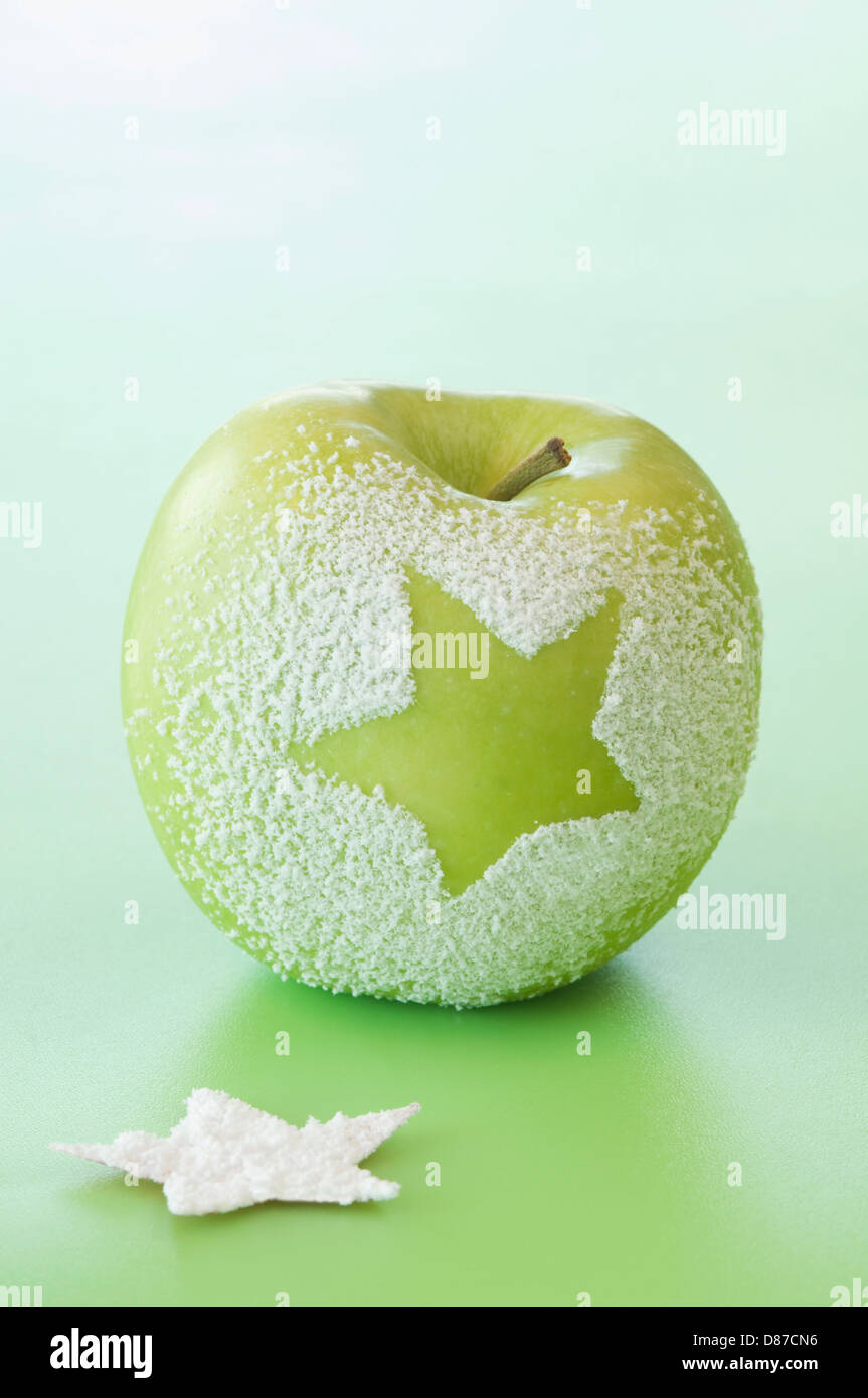 Apple with snow star, close up Stock Photo - Alamy
