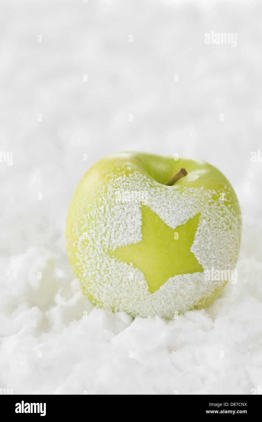 Apple with snow star, close up Stock Photo - Alamy