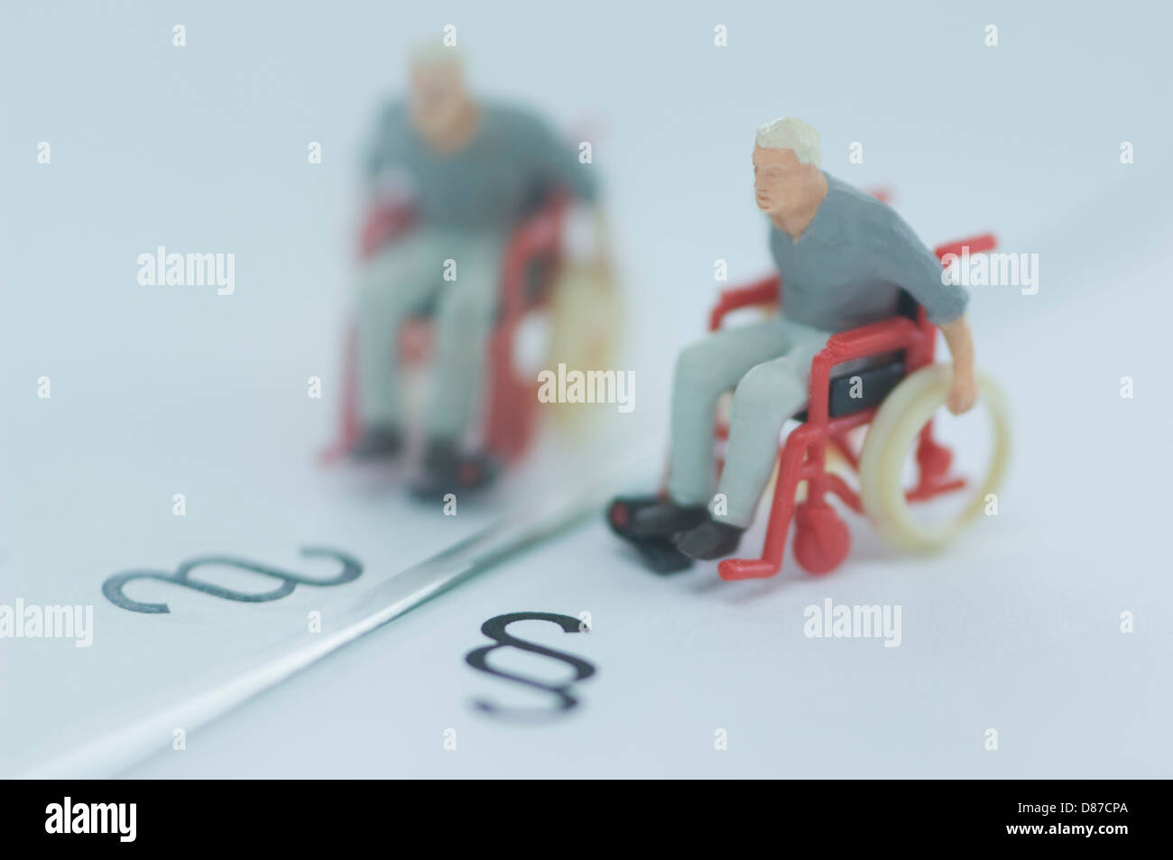 Figurine in wheelchair hi-res stock photography and images - Alamy