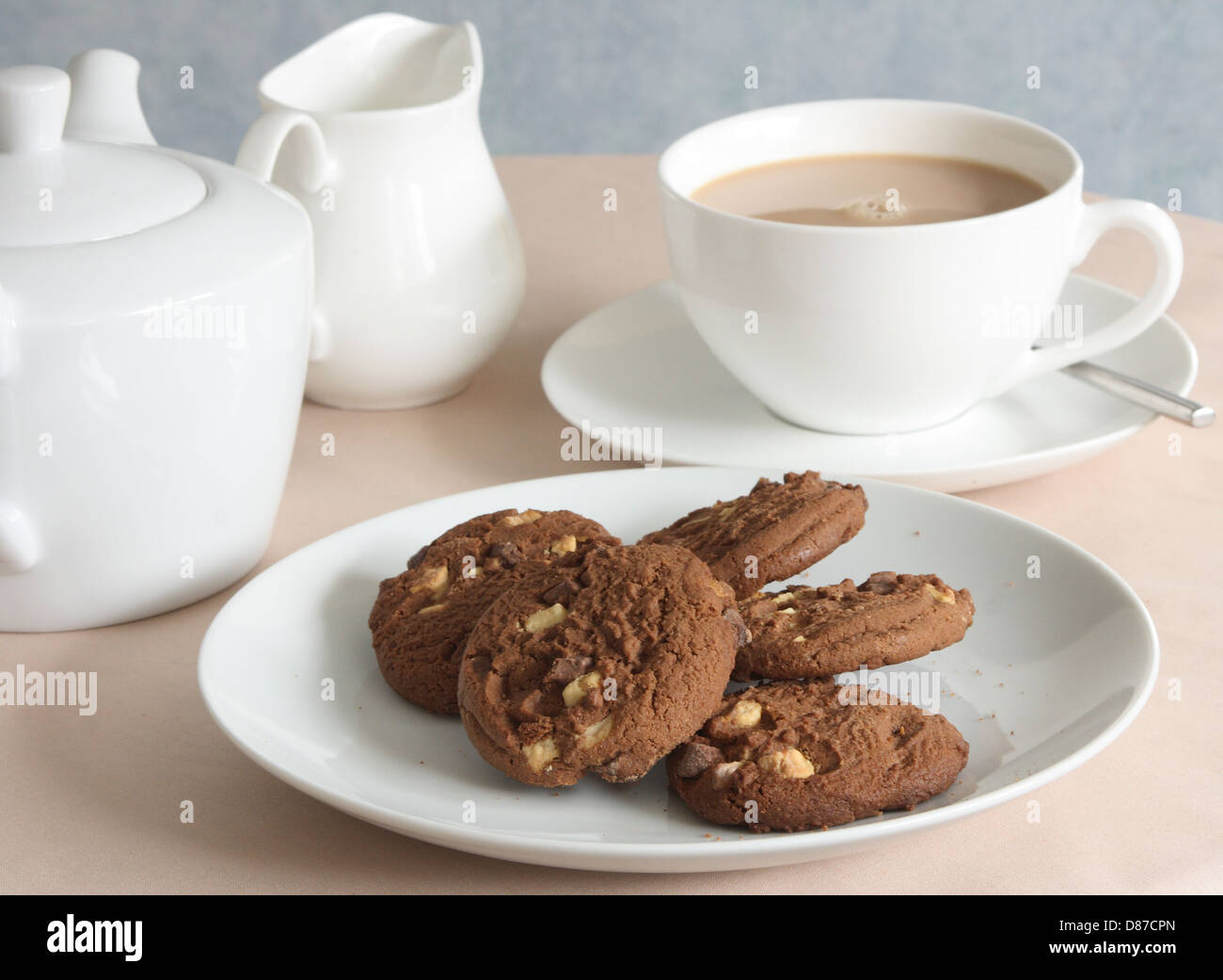 A cup of tea and chocolate biscuits Stock Photo - Alamy