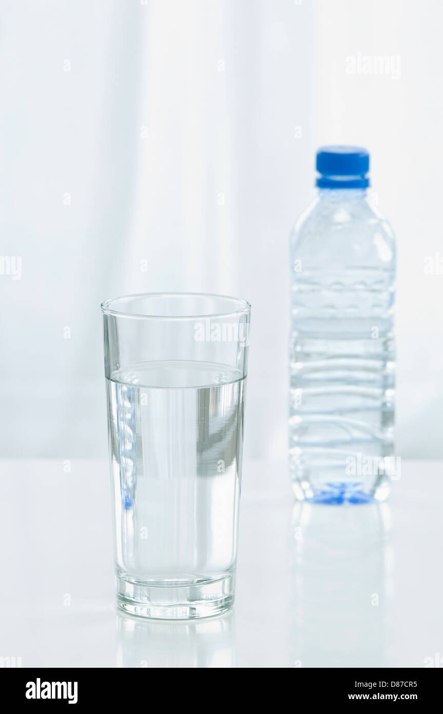 Water bottle glass on table Cut Out Stock Images & Pictures - Alamy