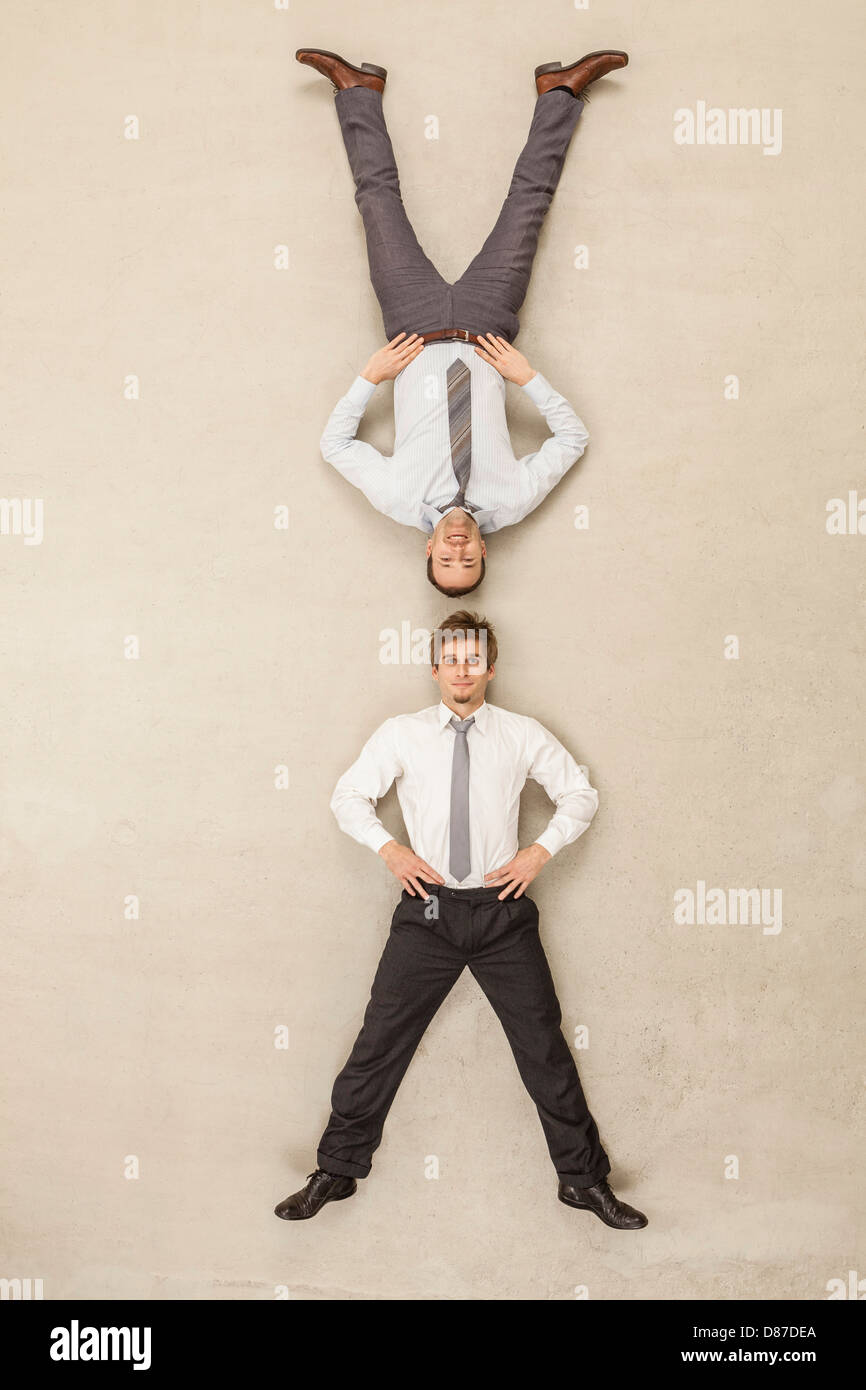 Businessmen with head to head position against beige background Stock ...