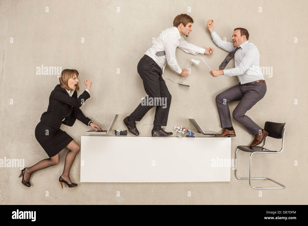 Business people fighting on office desk Stock Photo - Alamy
