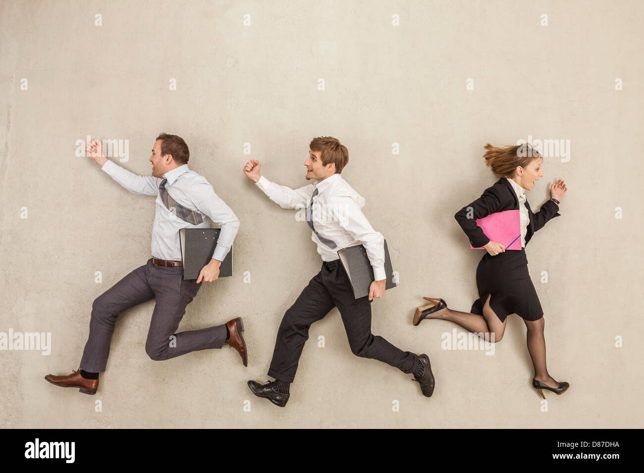 Business people running in opposite direction Stock Photo - Alamy