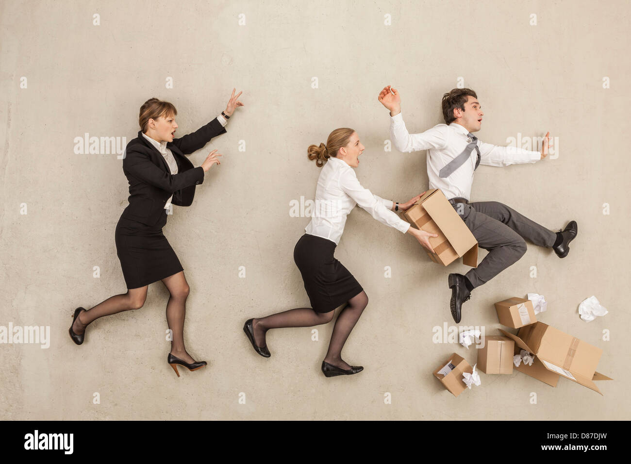 Business people chasing in office Stock Photo - Alamy