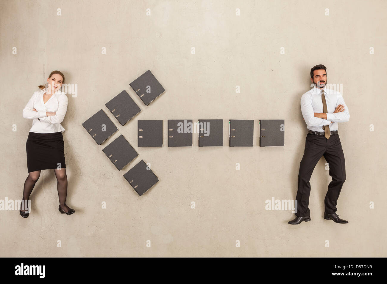 Files forming arrow sign between two business people Stock Photo - Alamy