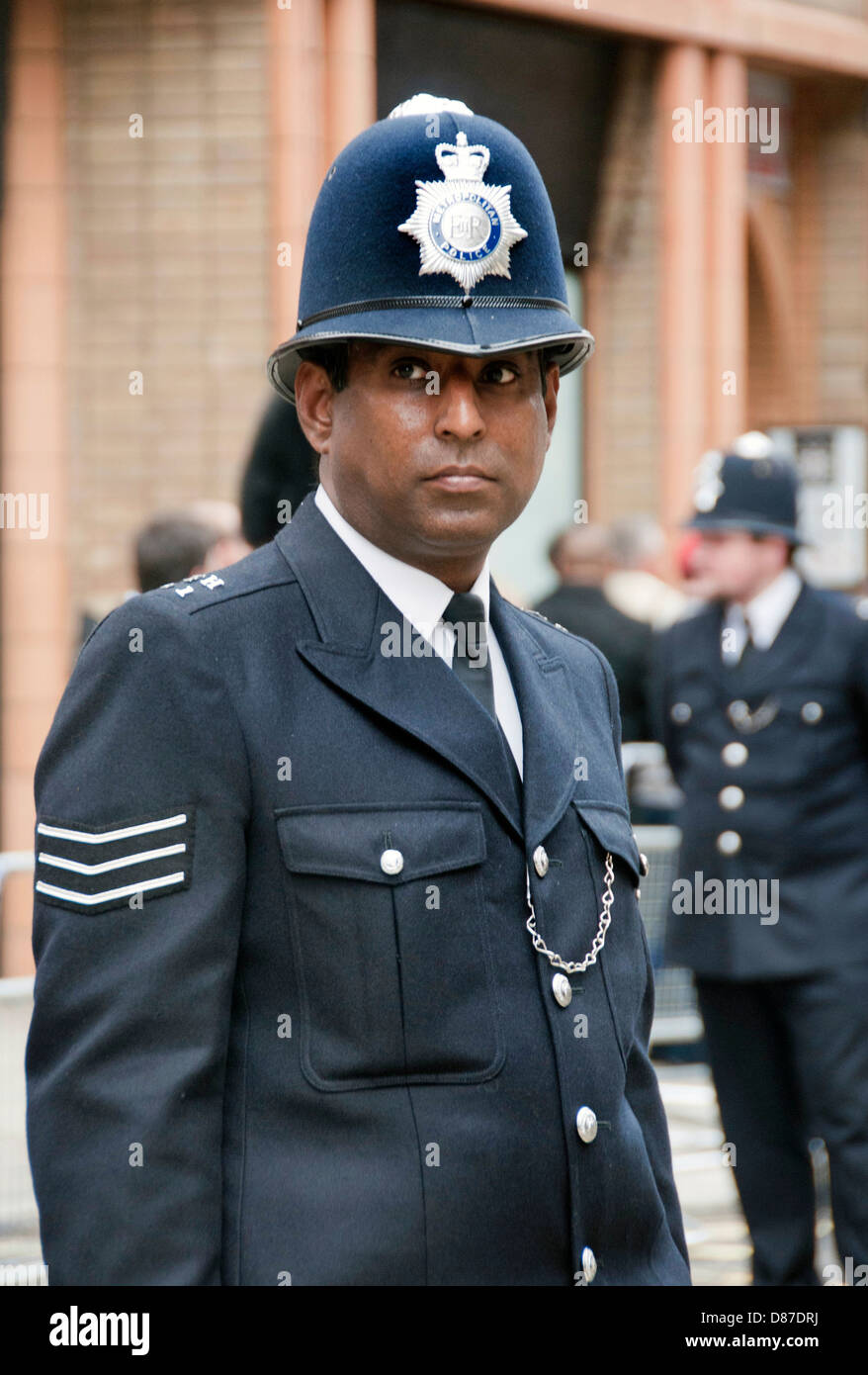 Asian police officer on duty in London Stock Photo - Alamy
