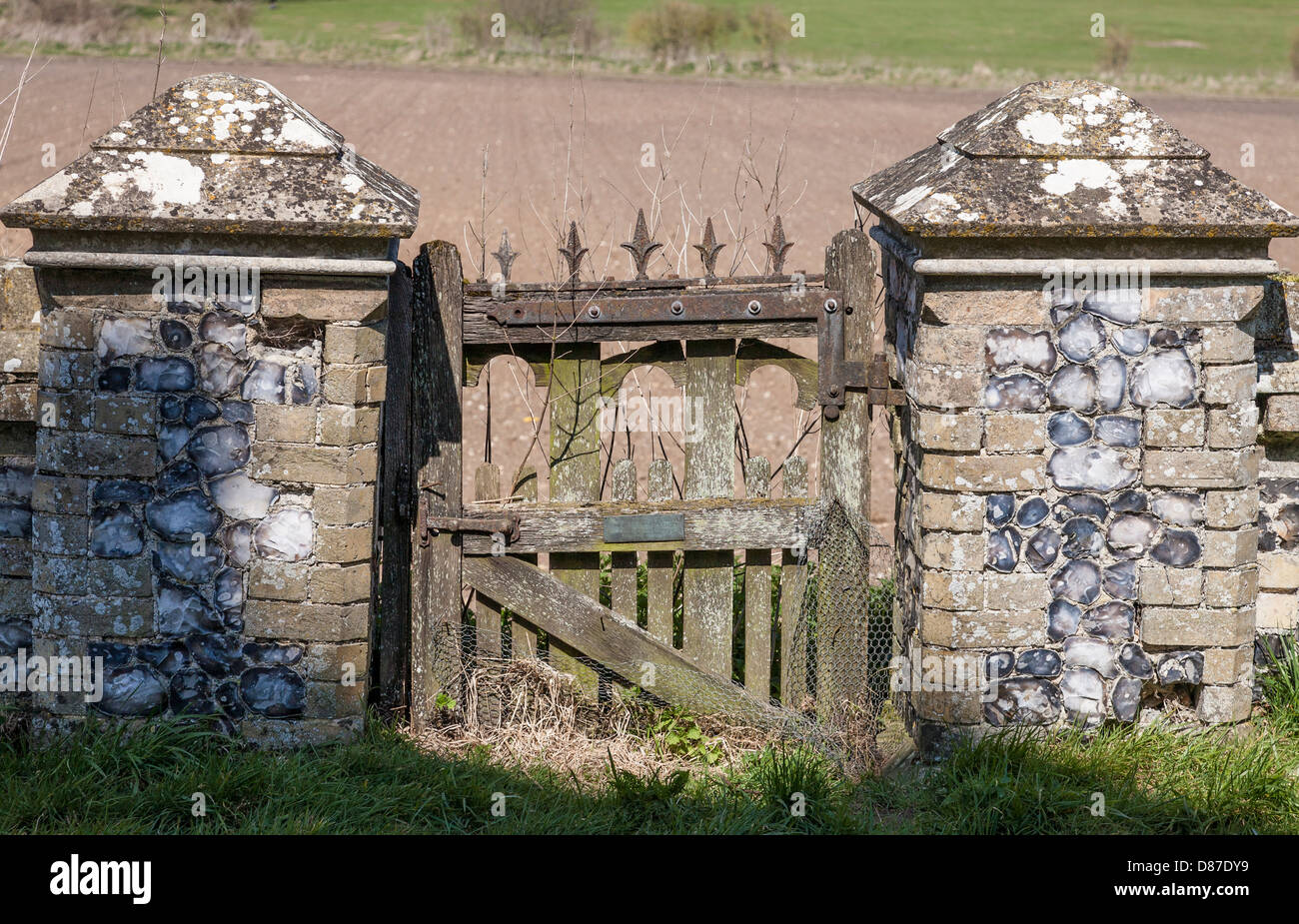 Ancient gateway between two brick and flint pillars Stock Photo - Alamy