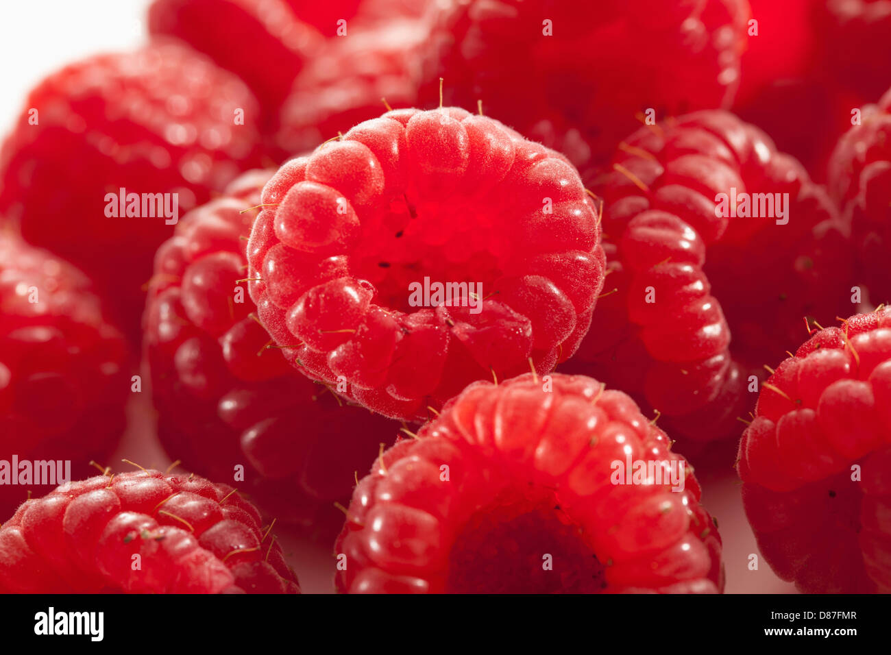 Raspberries on white background, close up Stock Photo - Alamy