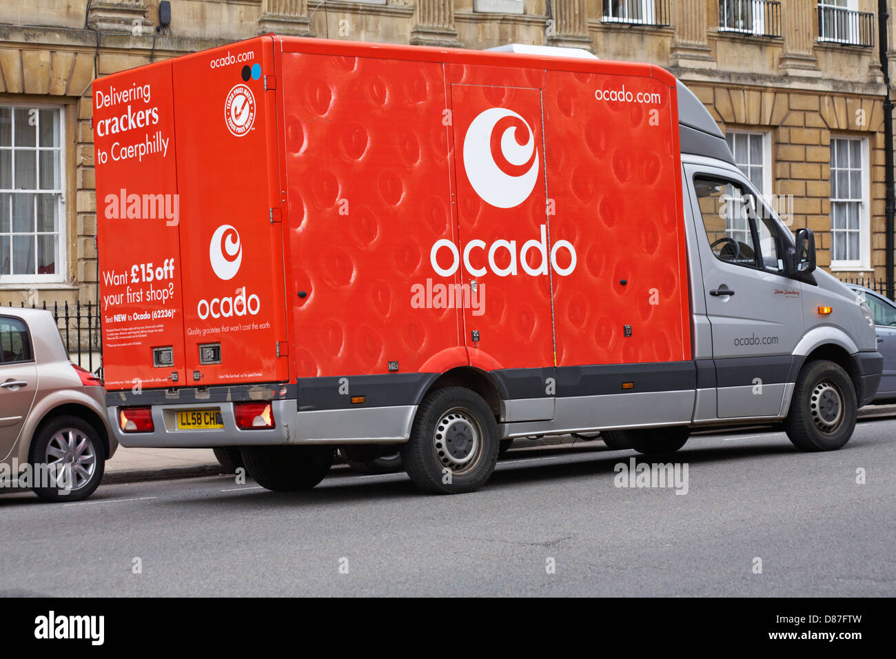 ocado delivery van making deliveries in street at Bath, Somerset UK in ...