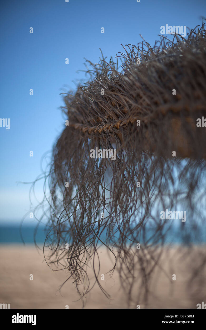 An extreme close up of the parasols on the beach in Vilamoura, Portugal ...
