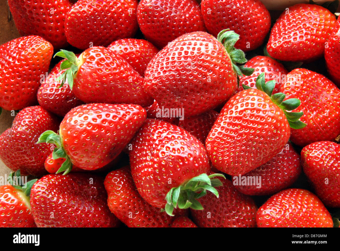 set in a box of strawberries before eating Stock Photo - Alamy