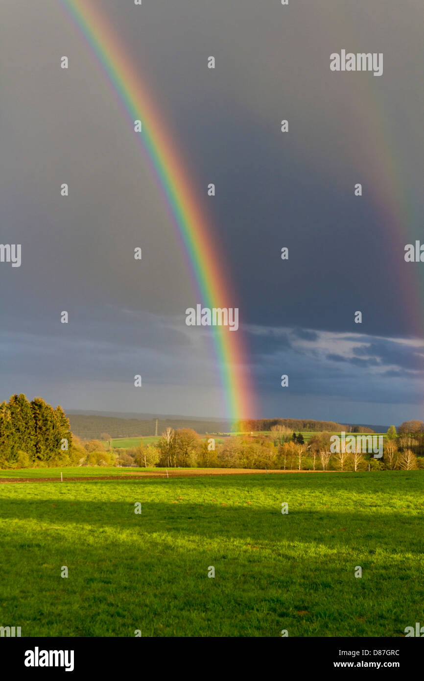 Europe, Germany, Rhineland-Palatinate, View of rainbow at rural ...