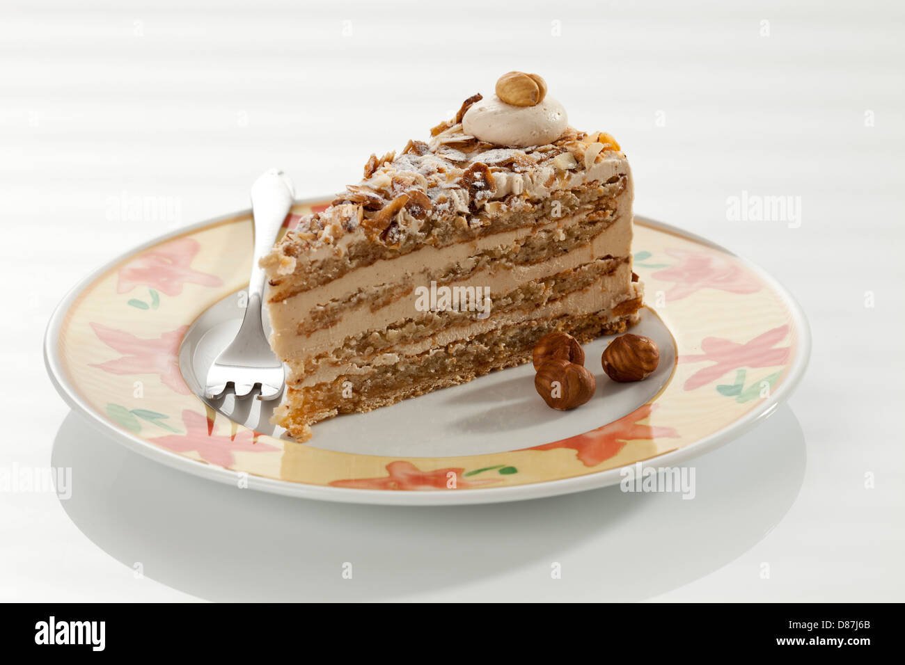 Plate of Noisette Cake with nut on plate, close up Stock Photo - Alamy