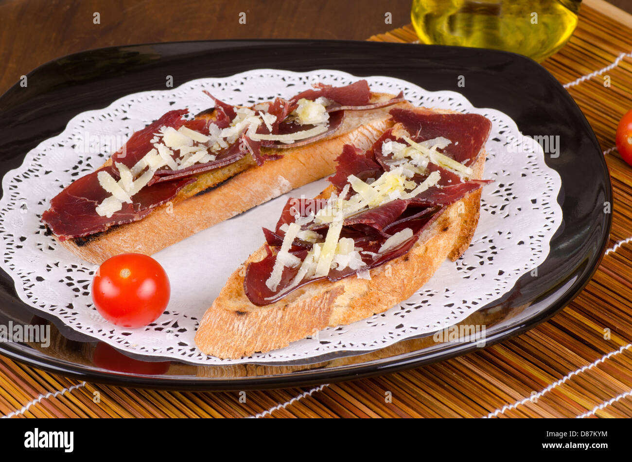 Traditional Spanish pintxo with air dried beef meat and cheese Stock ...