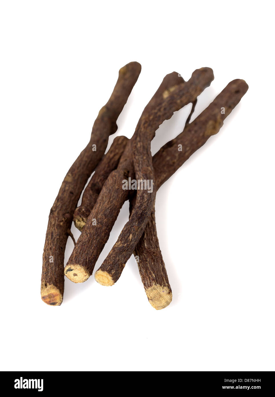 Licorice roots isolated on white background Stock Photo - Alamy
