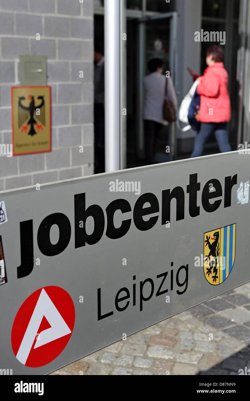 Visitors and employees walk into the Jobcenter in Leipzig, Germany, 21 ...