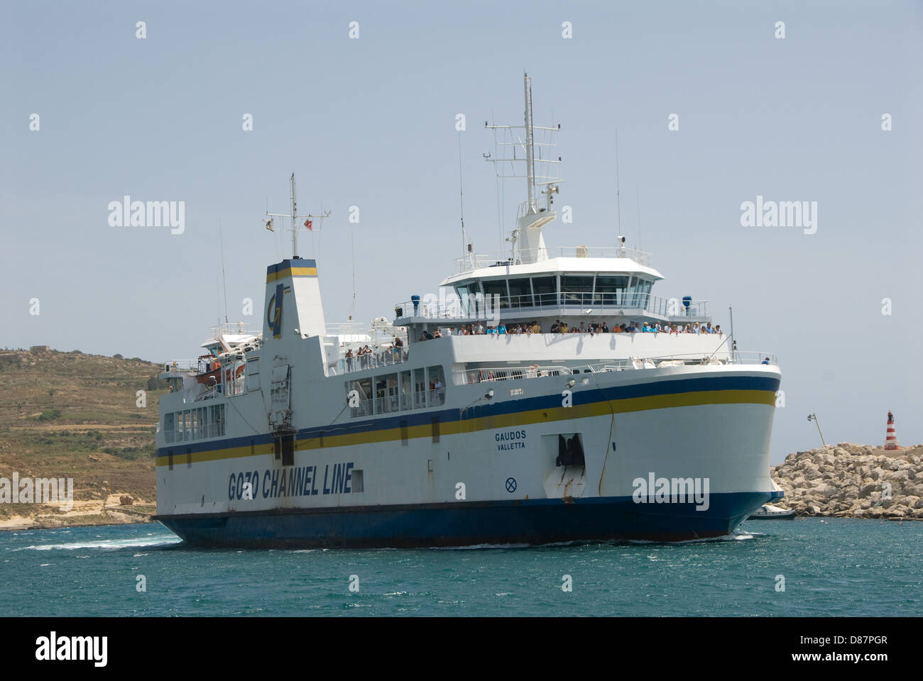 A Gozo Channel ferry arrives at Mgarr harbour on the Maltese island of ...