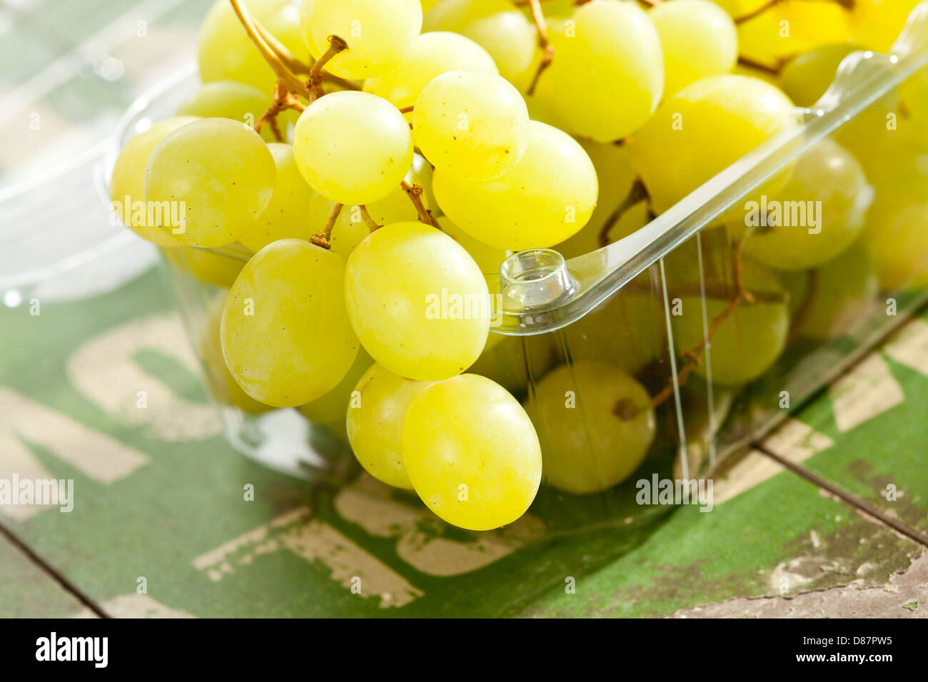 White grapes in plastic dish, close up Stock Photo - Alamy