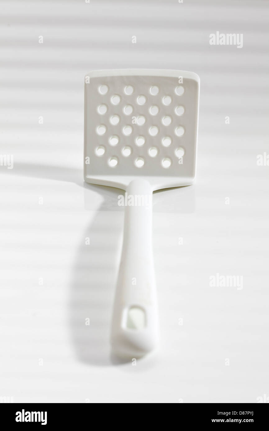 White spatula on white background, close up Stock Photo - Alamy