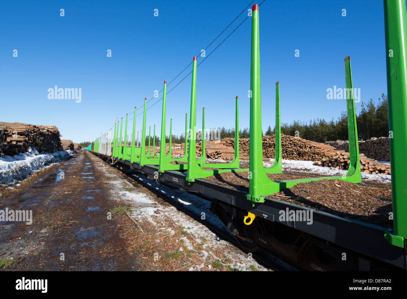 View of railroad depot for log transport and storage , log piles and ...