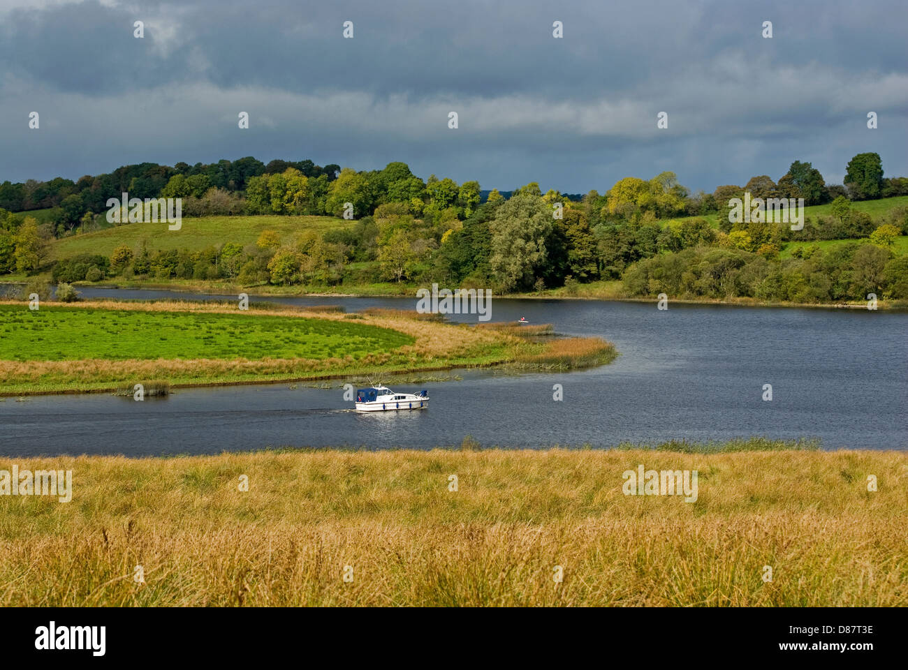 Boat cruiser making its way up the Upper Lough Erne, County Fermanagh ...