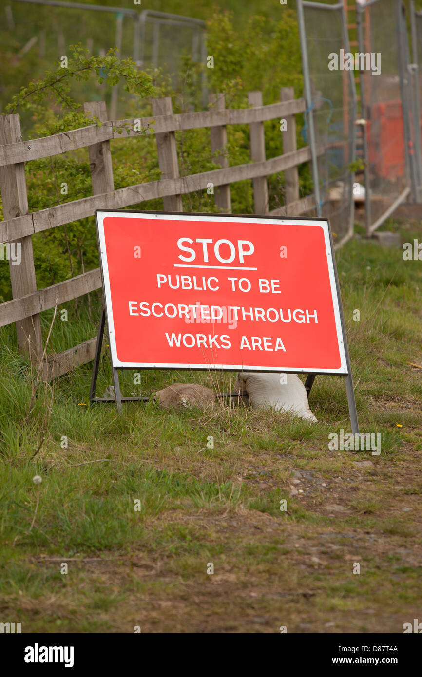 Warning sign near construction site. Stating that "Public to be ...
