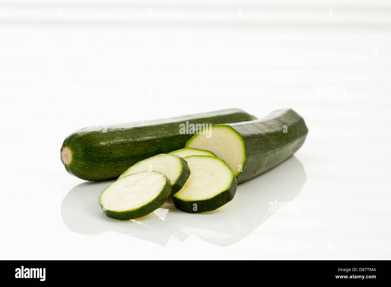 Zucchini on white background, close up Stock Photo - Alamy